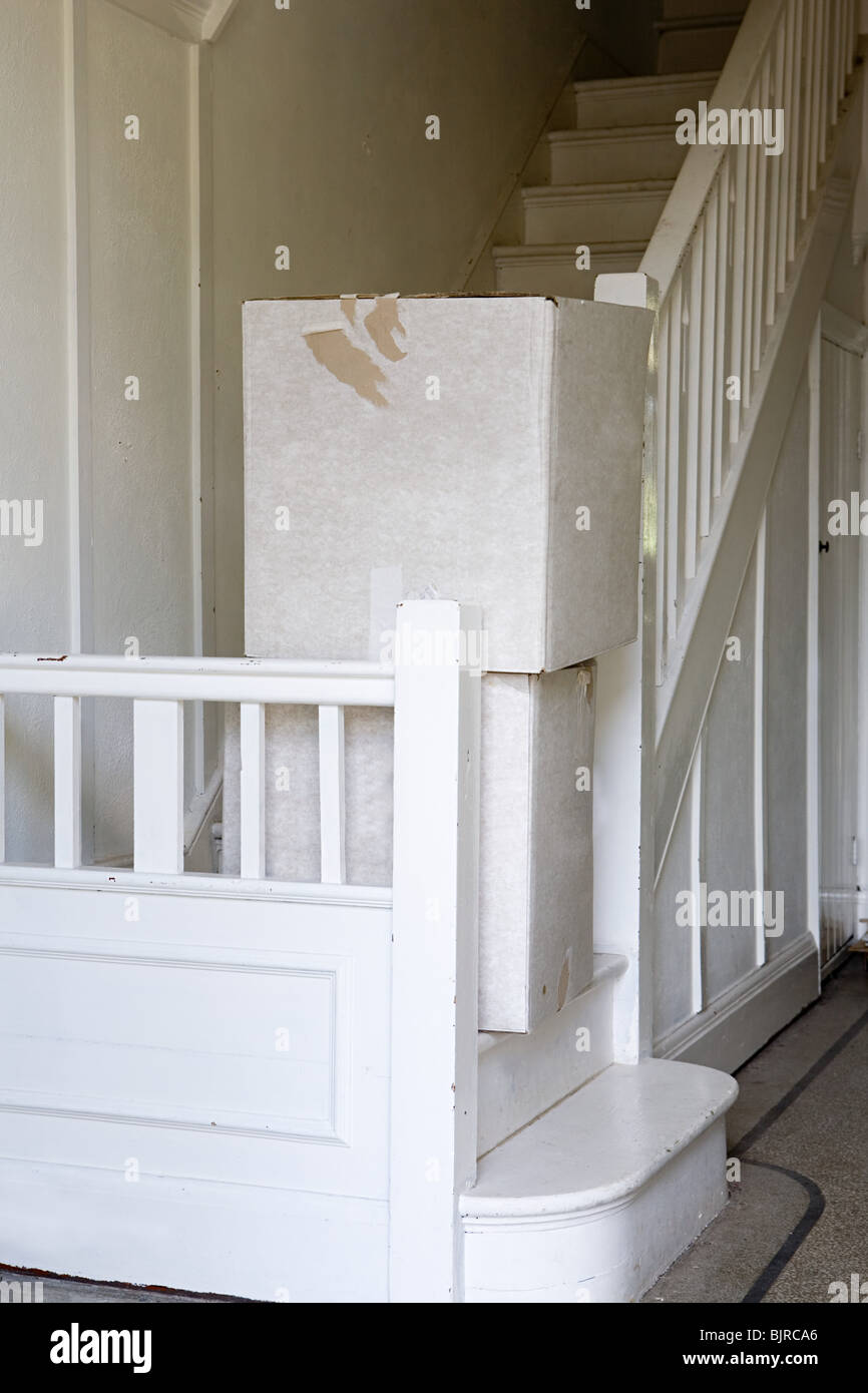 Cardboard boxes on staircase Stock Photo - Alamy