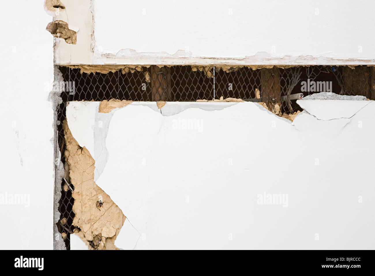 Damaged plasterboard wall Stock Photo - Alamy