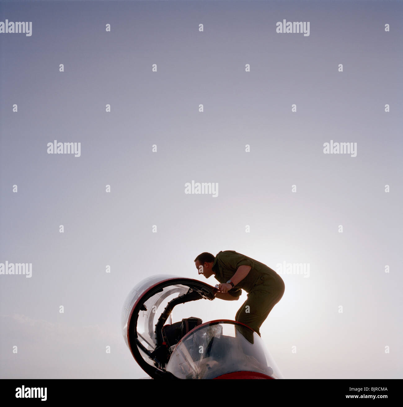 RAF Junior Technician engineer polishes open cockpit canopy before ...
