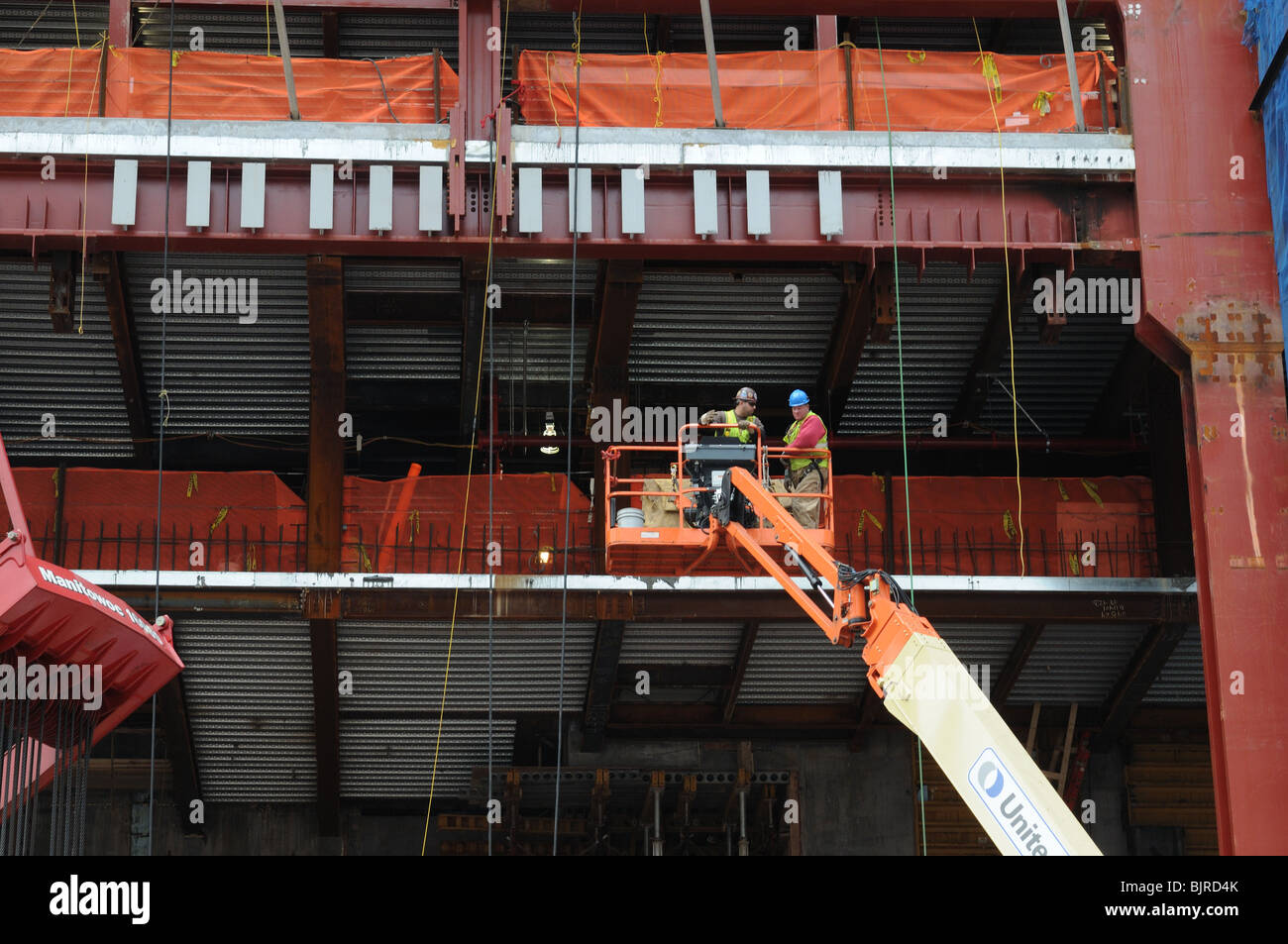 Construction workers at work on Tower 1 at the World Trade Center site ...