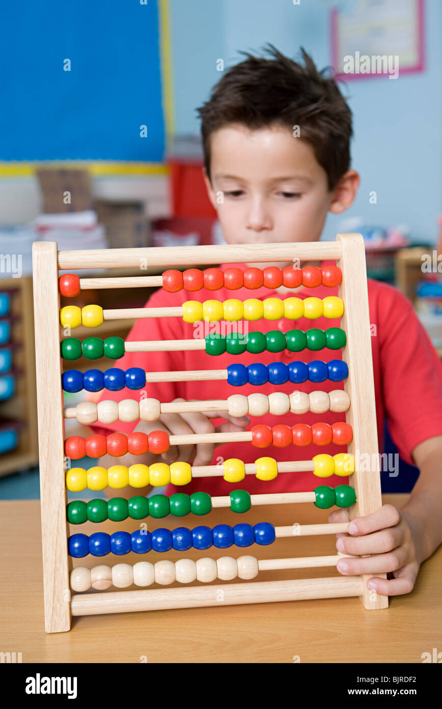 Boy counting on an abacus Stock Photo - Alamy