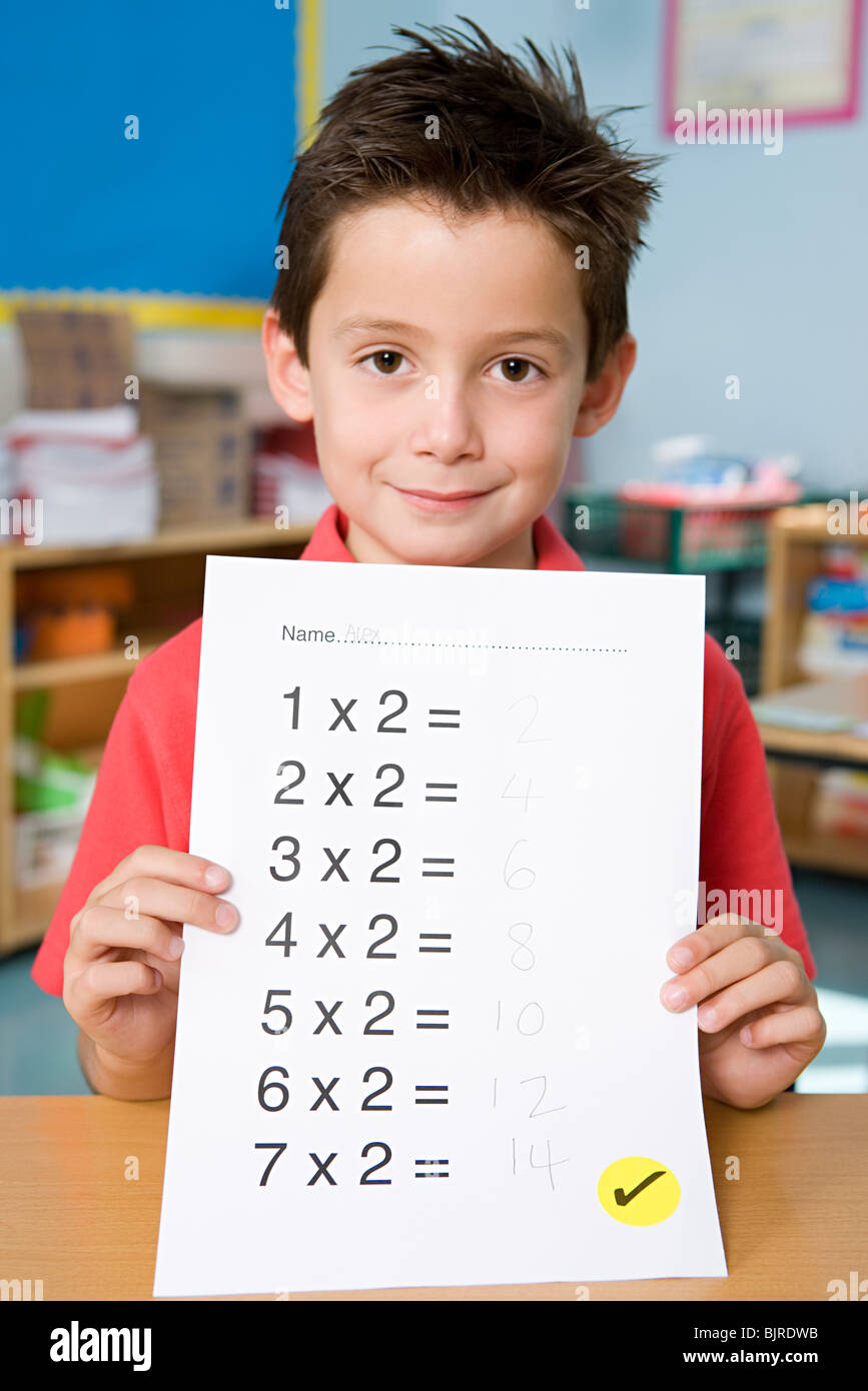 Boy holding exam paper Stock Photo - Alamy Boy holding exam paper Stock Photo - Alamy