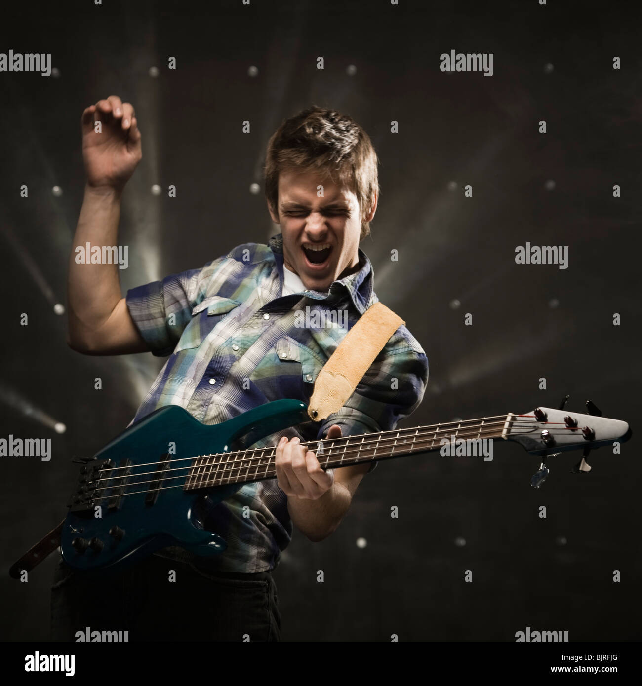 Studio shot of guitarist playing on electric guitar Stock Photo - Alamy
