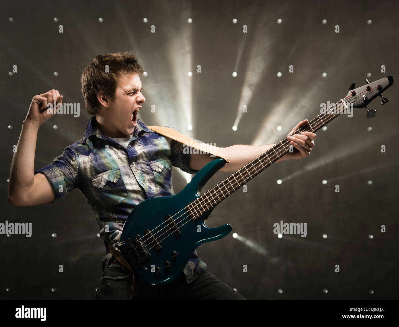 Studio shot of guitarist playing on electric guitar Stock Photo - Alamy