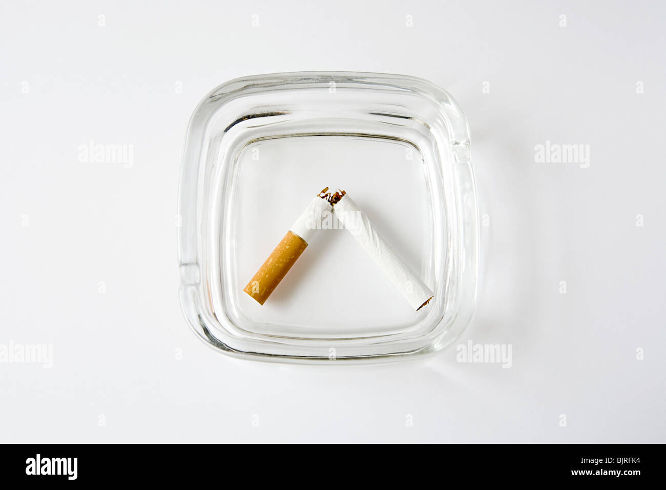 Broken cigarette in an ashtray Stock Photo - Alamy
