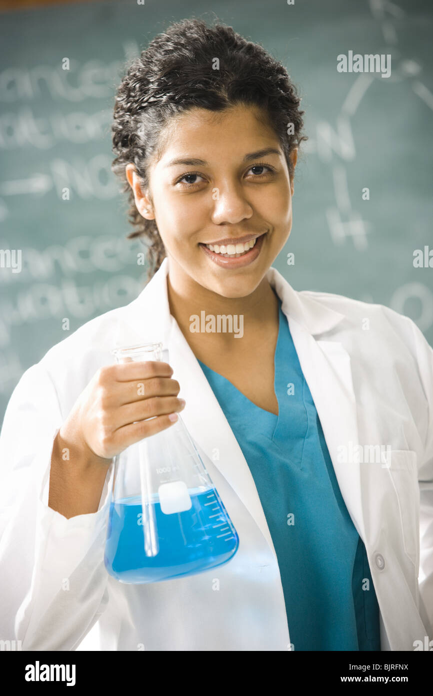 Female science teacher standing in front of a blackboard Stock Photo ...