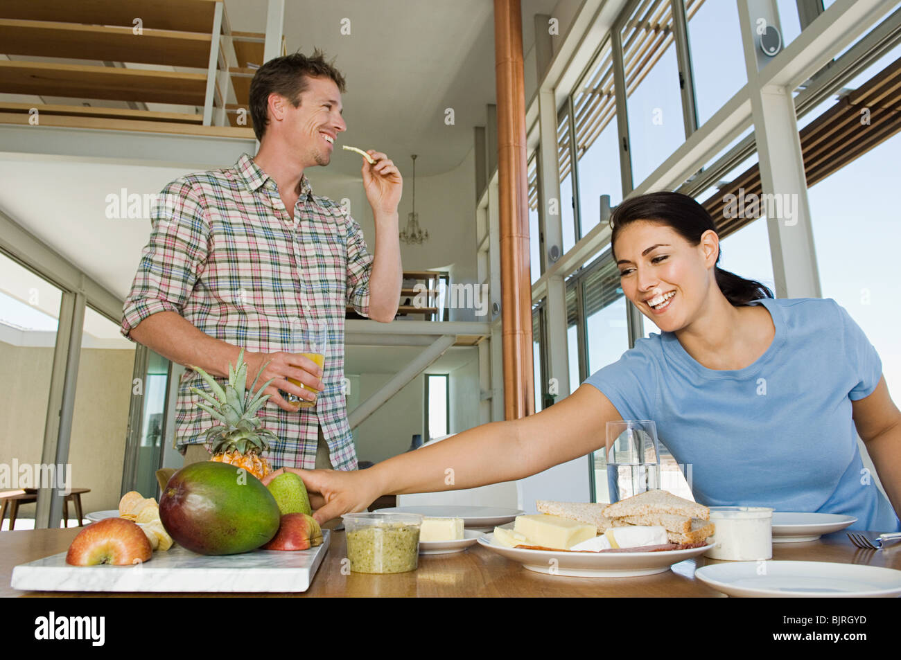 Couple having food Stock Photo - Alamy