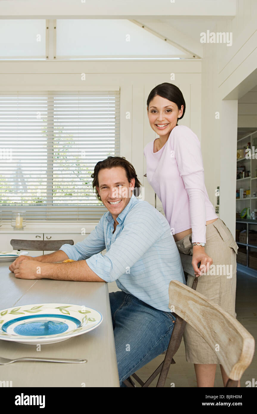 Couple at dining table Stock Photo - Alamy