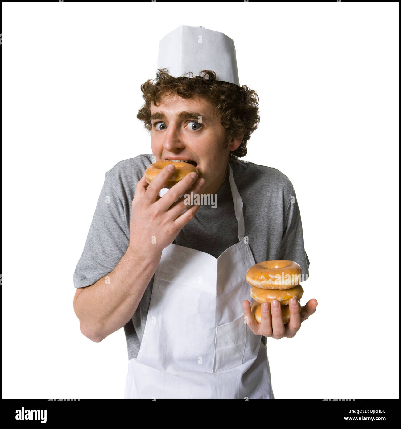 Cook eating donuts Stock Photo - Alamy