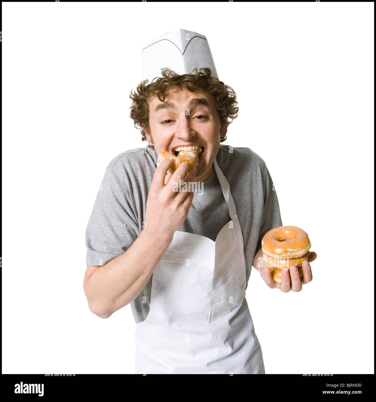 Cook eating donuts Stock Photo - Alamy