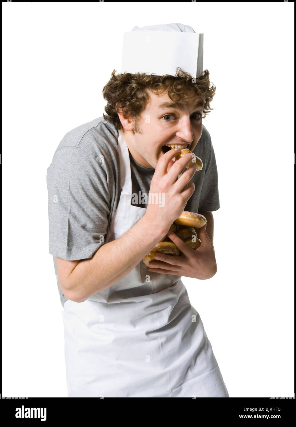 Cook eating donuts Stock Photo - Alamy