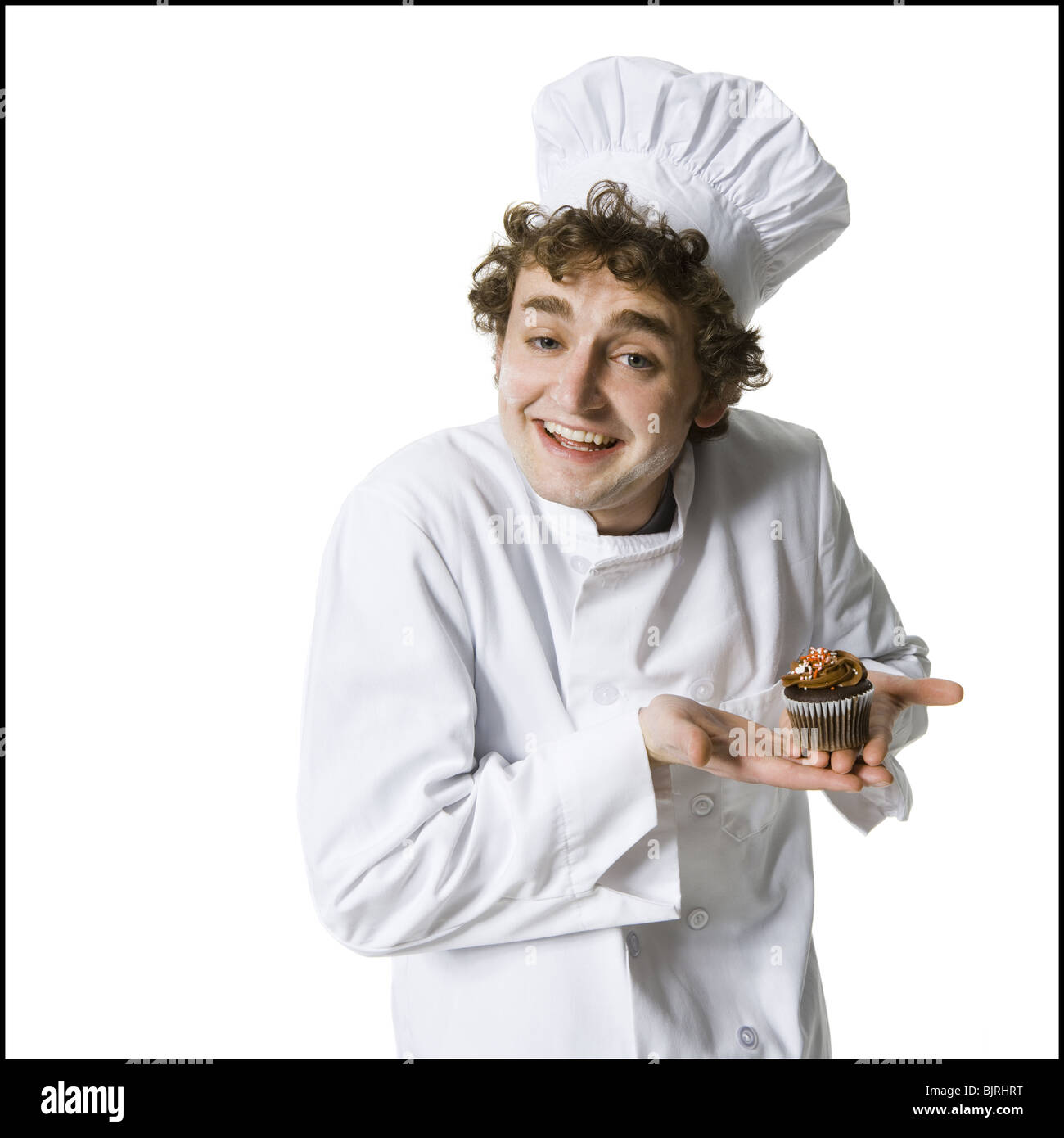 Chef with cupcake Stock Photo - Alamy