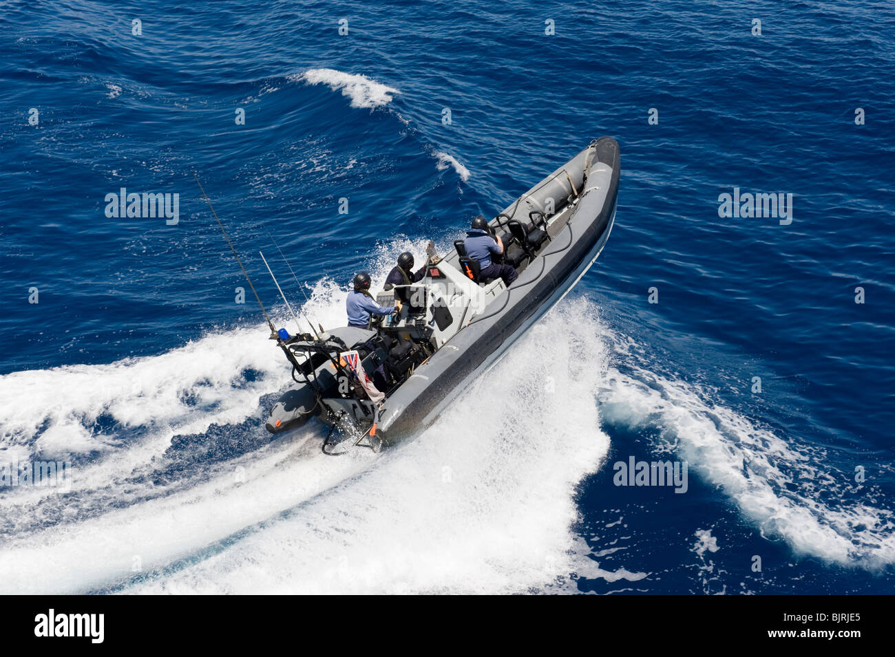Royal Navy RIB seaboat being deployed from Type 23 frigate at sea Stock ...
