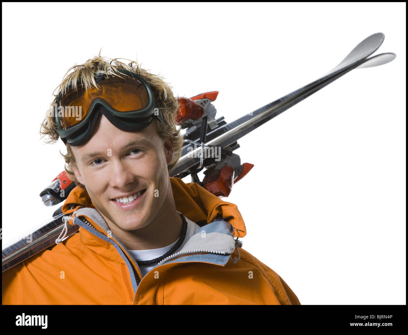 Male skier in orange ski jacket Stock Photo - Alamy