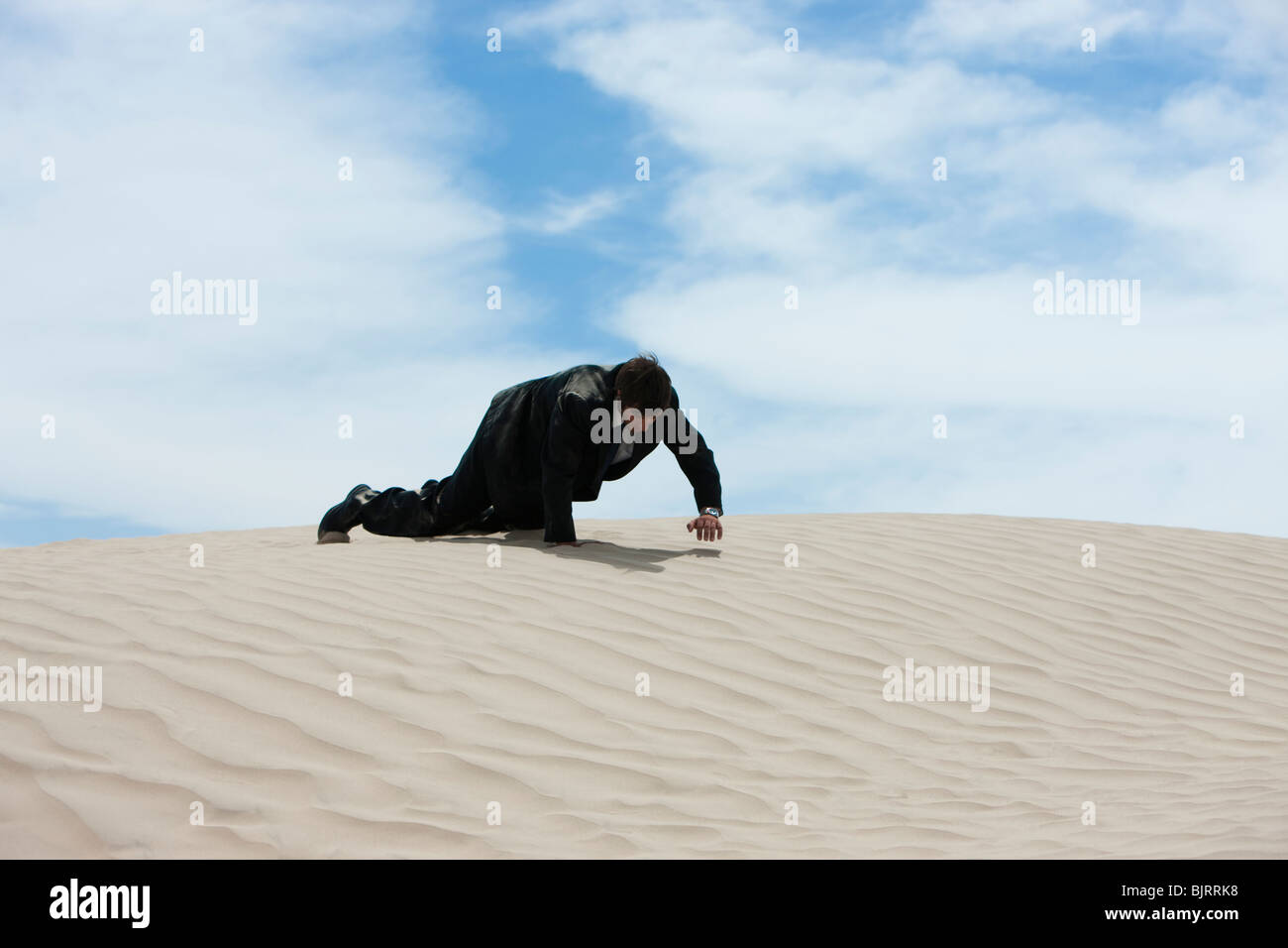Man crawling sand hi-res stock photography and images - Alamy