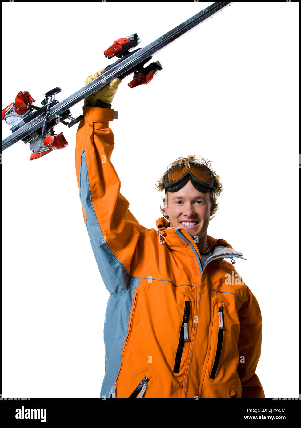 Male skier in orange ski jacket Stock Photo - Alamy