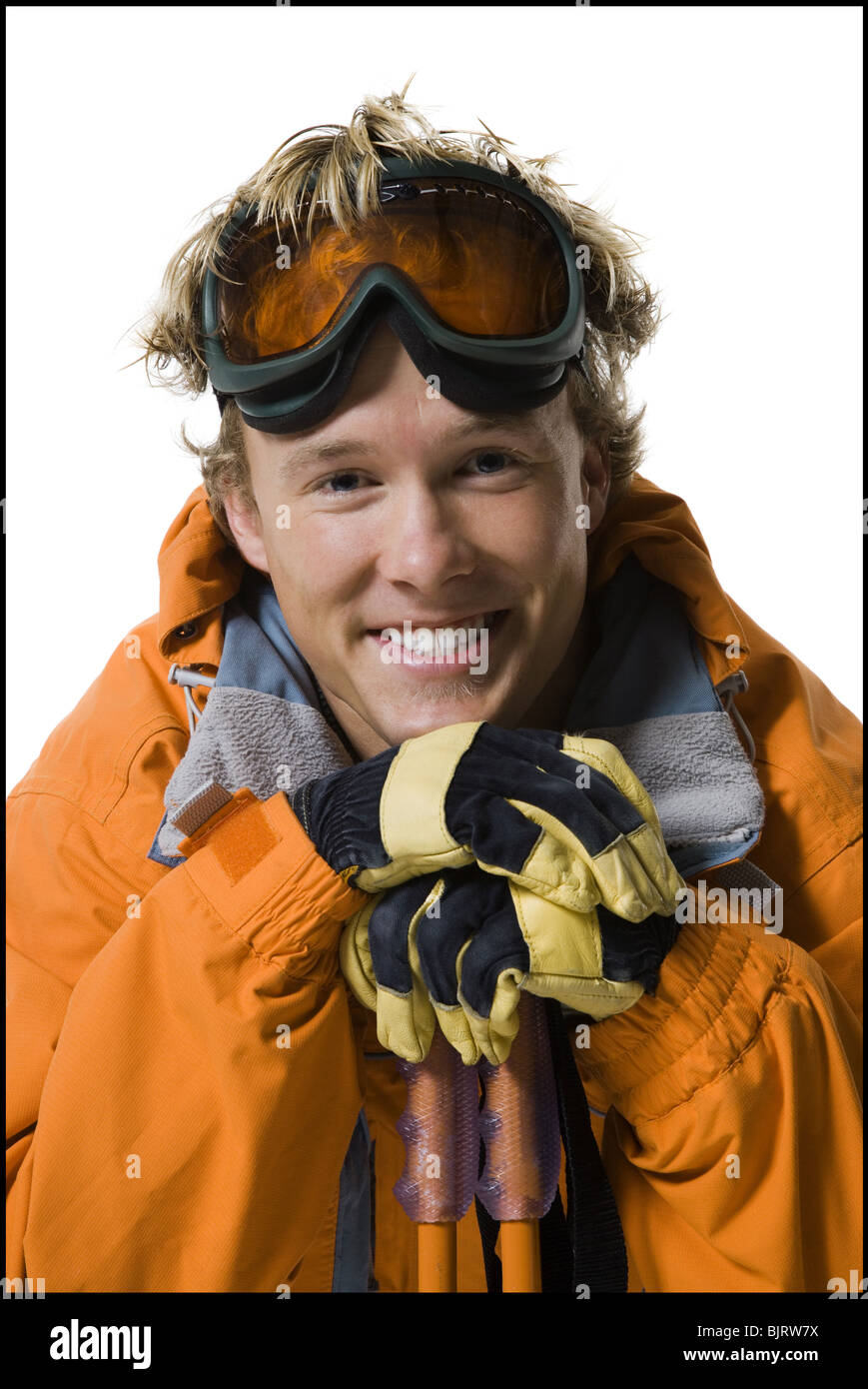 Male skier in orange ski jacket Stock Photo - Alamy