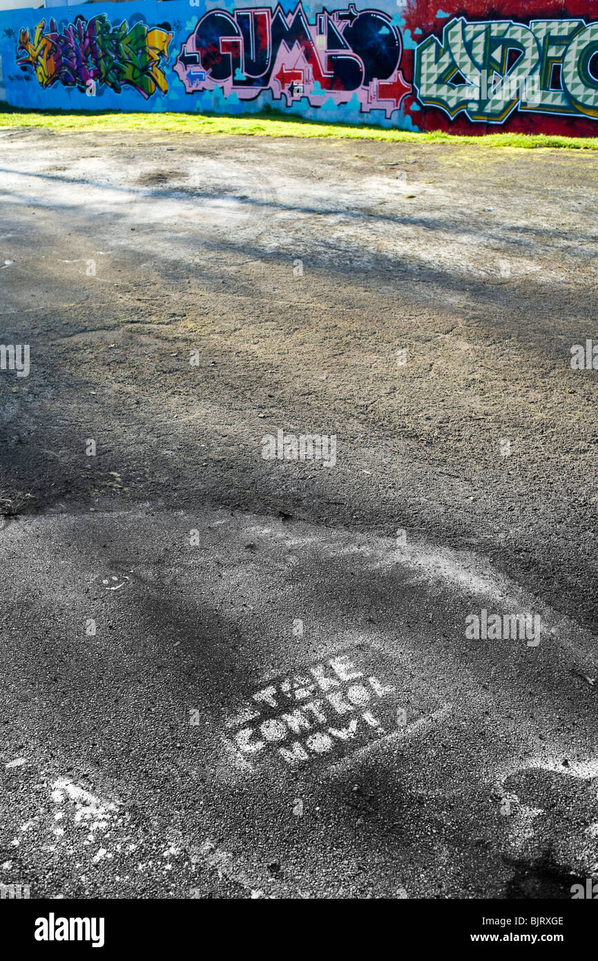 Take control now graffiti in tarmac Stock Photo - Alamy