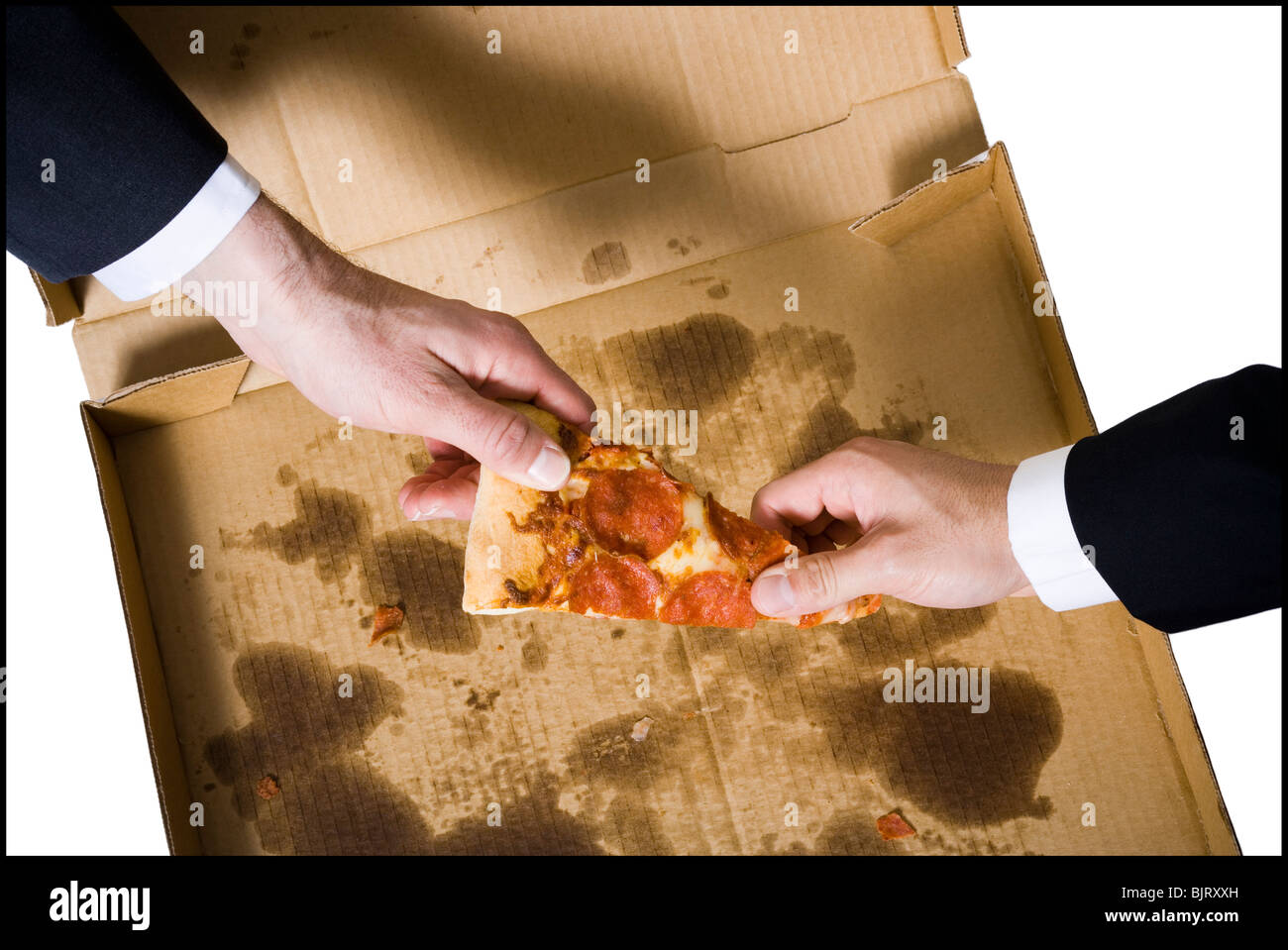 business men fighting over last slice of pizza Stock Photo - Alamy