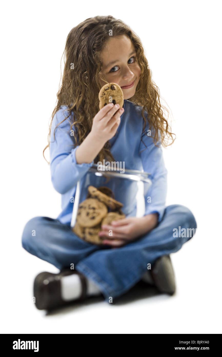 Child sneaking cookie hi-res stock photography and images - Alamy
