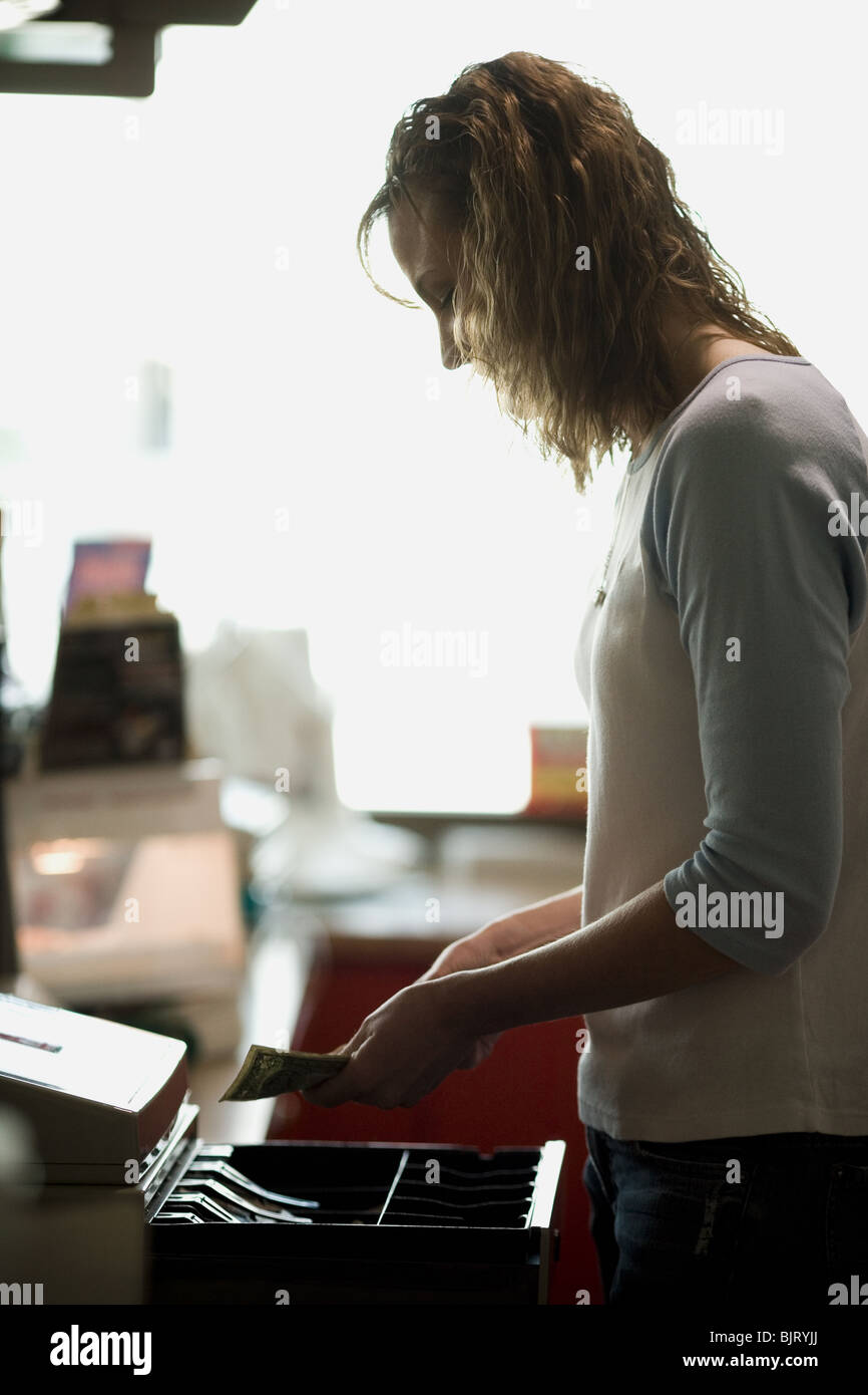 Female clerk in retail store Stock Photo - Alamy