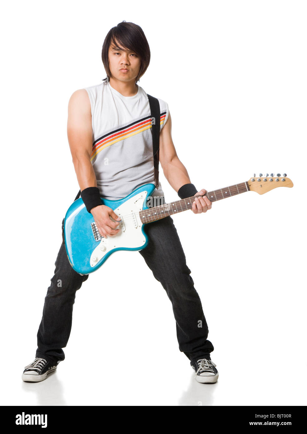Young man playing electric guitar, portrait Stock Photo - Alamy