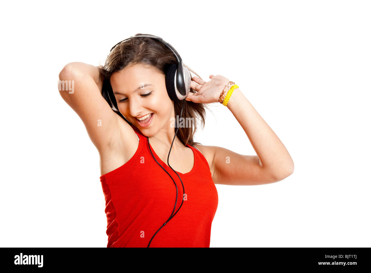 Beautiful girl listen music isolated on white Stock Photo - Alamy
