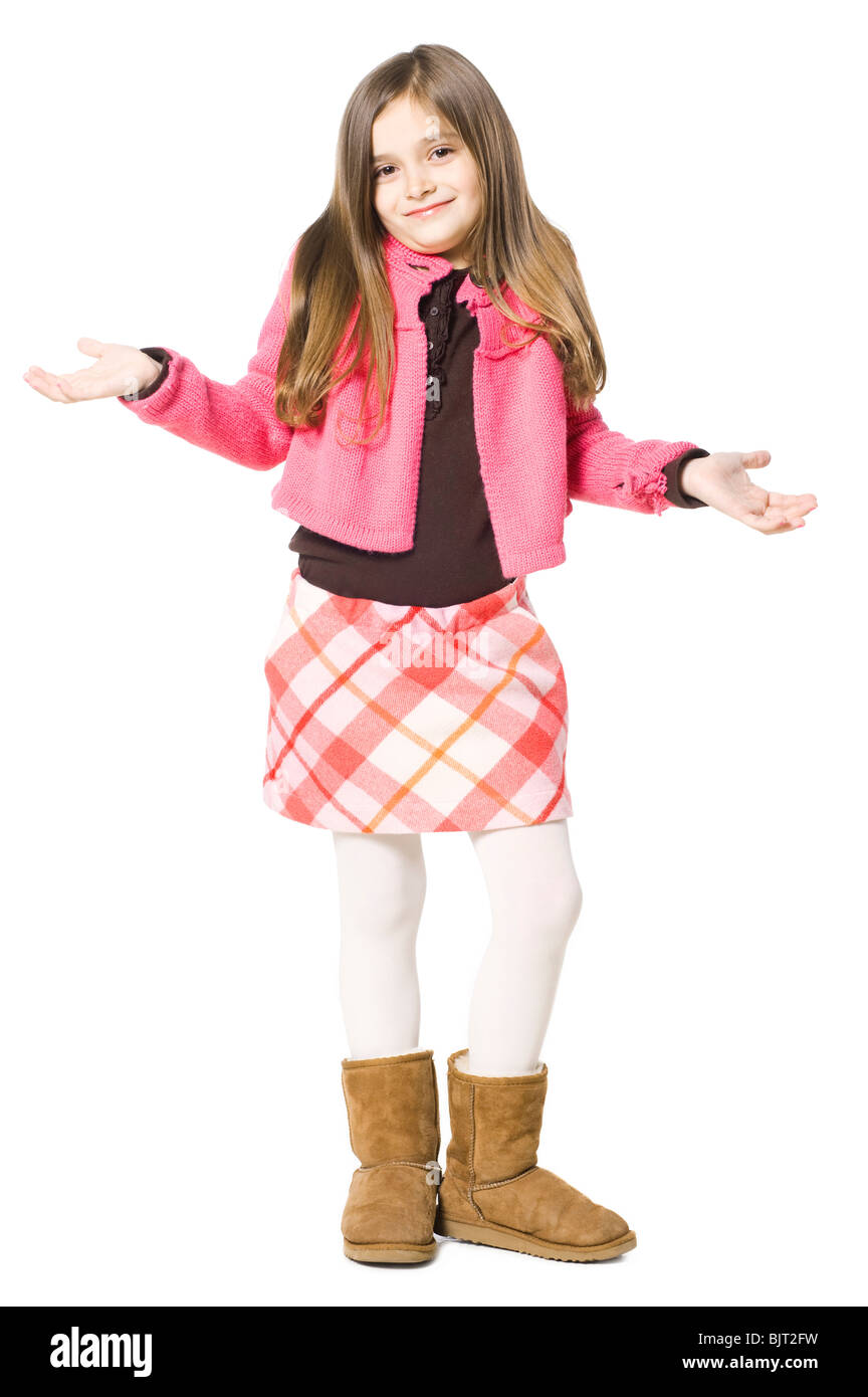 Studio portrait of girl (8-9) with arms up Stock Photo - Alamy