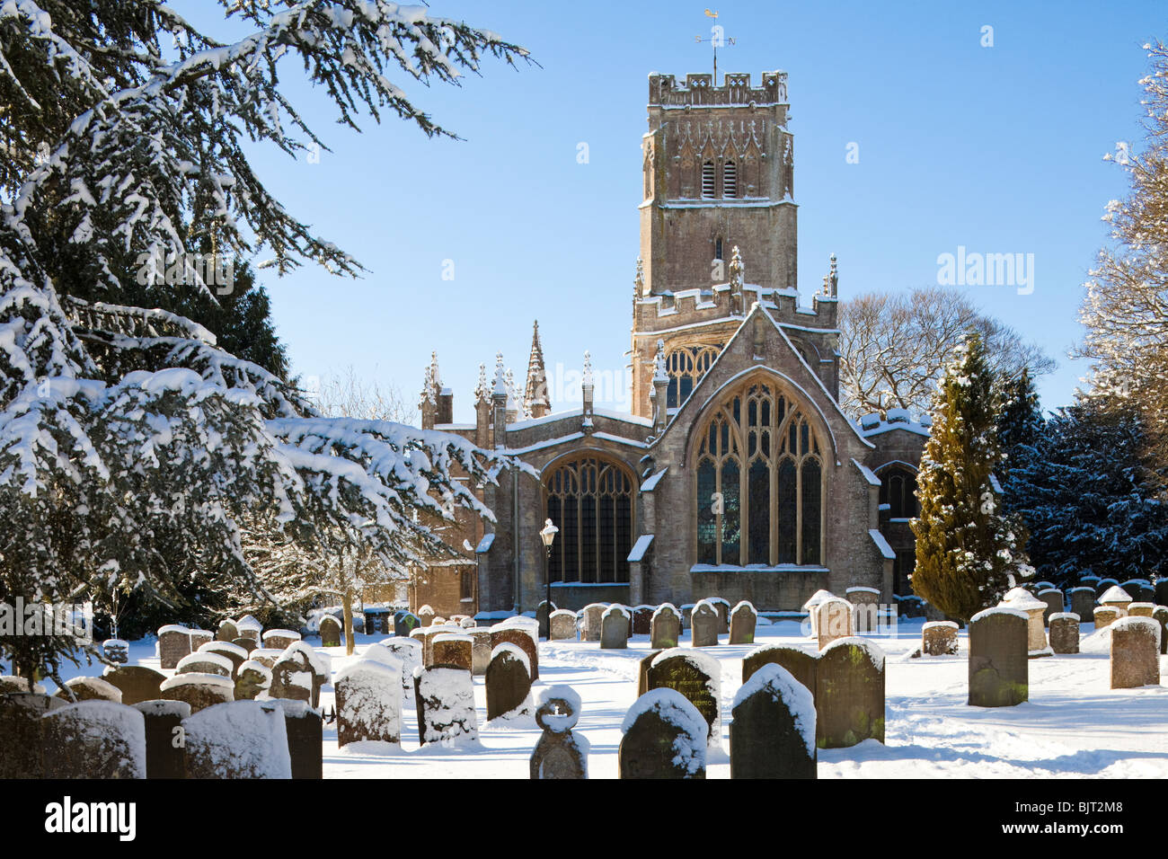 Winter snow on the Cotswolds at the wool church of St Peter & St Paul ...