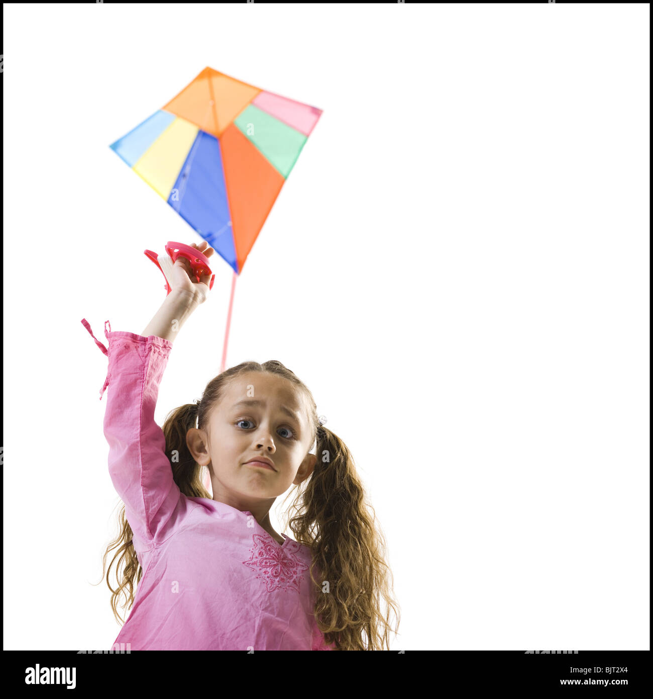Young girl flying a kite Stock Photo - Alamy