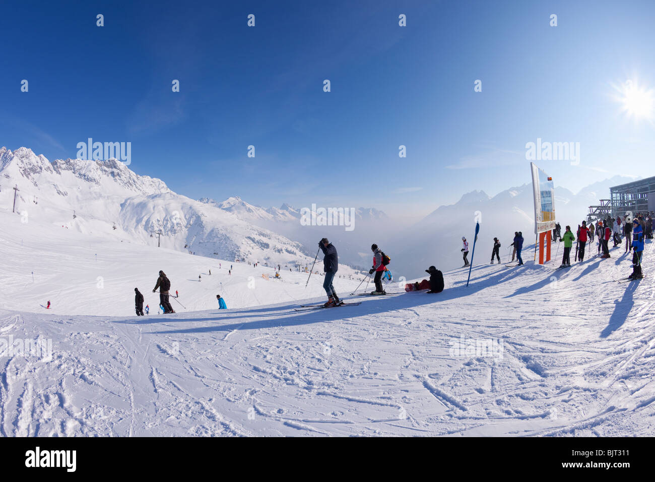 Skiers skiing down ski slopes below Valluga cable car cable-car Galzig ...