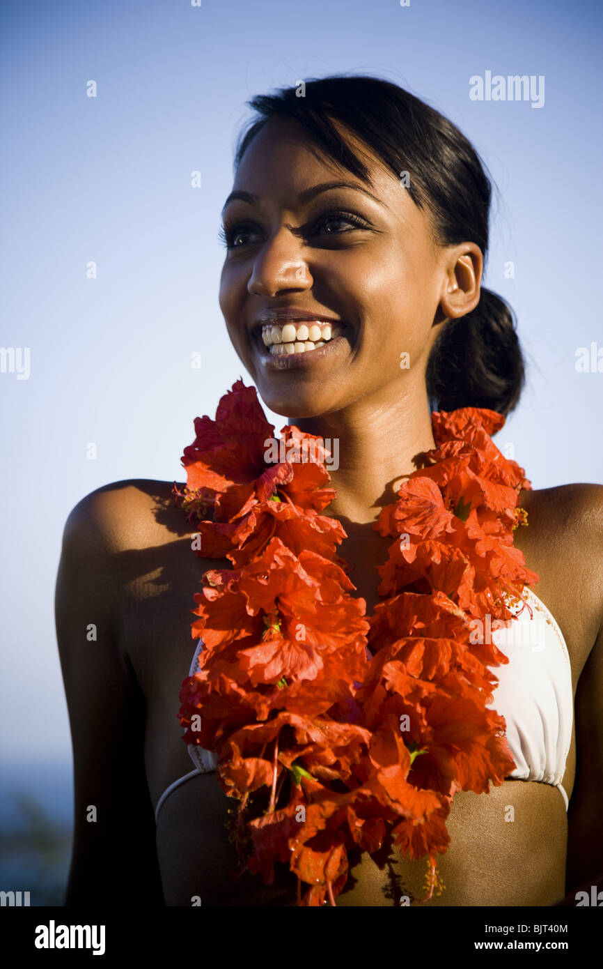 African-American woman with a red lei Stock Photo - Alamy