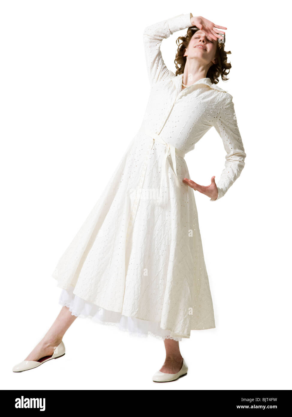 Happy young woman dancing, studio shot Stock Photo - Alamy