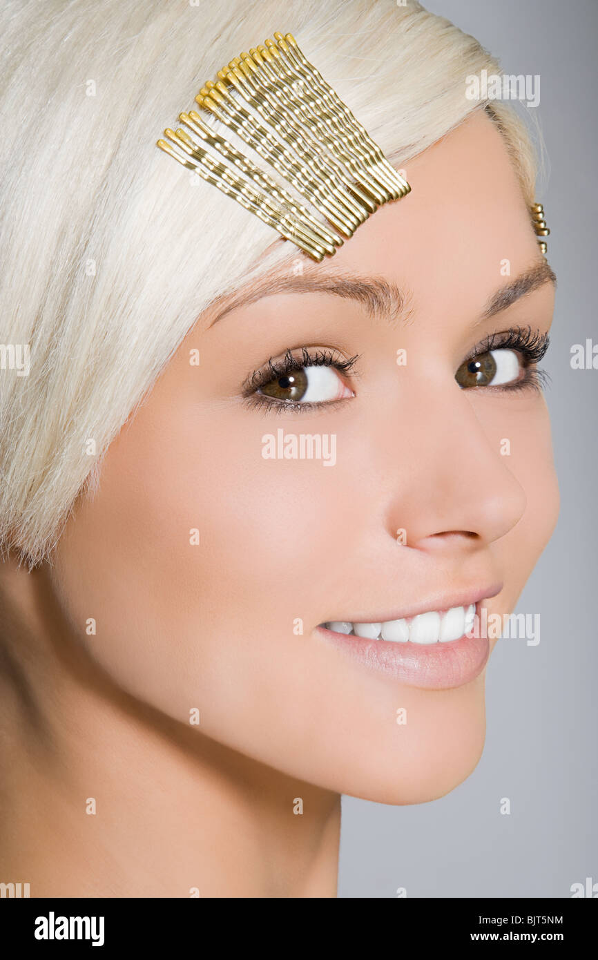 Portrait of a woman wearing hair clips Stock Photo - Alamy