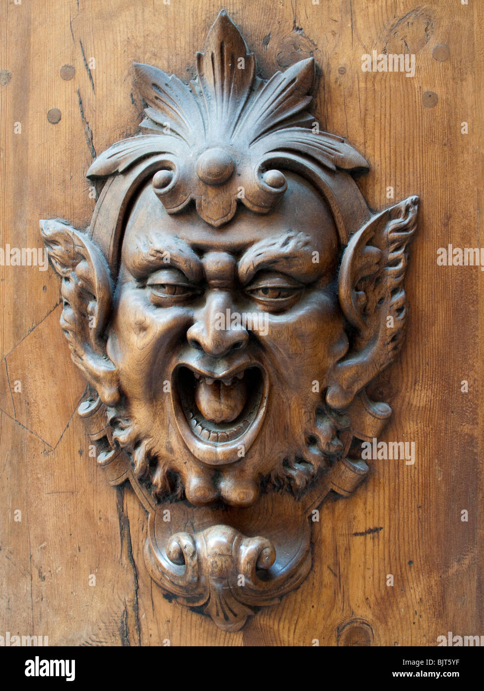 Grotesque carved head door siena hi-res stock photography and images ...