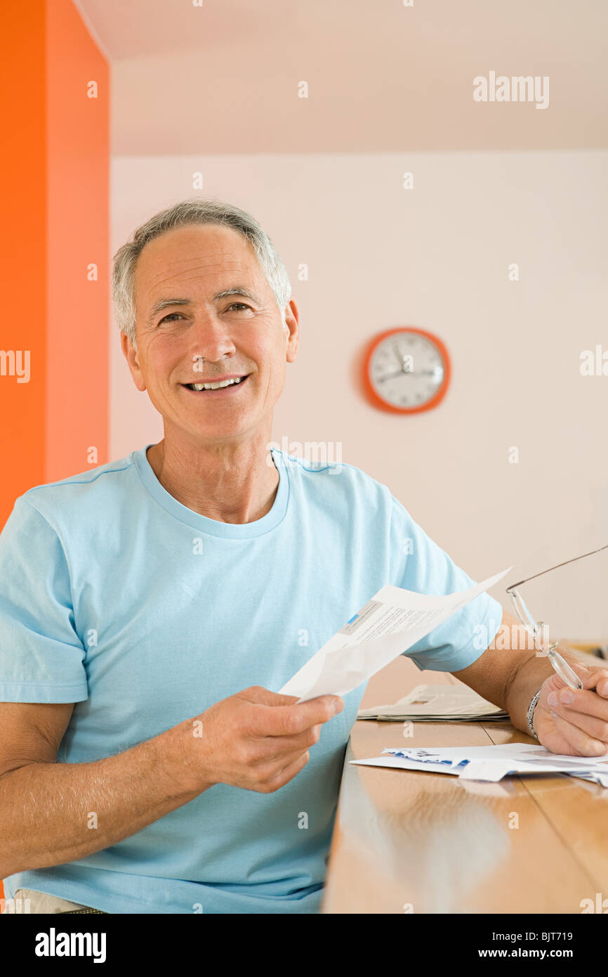 Portrait of a man holding a letter Stock Photo - Alamy
