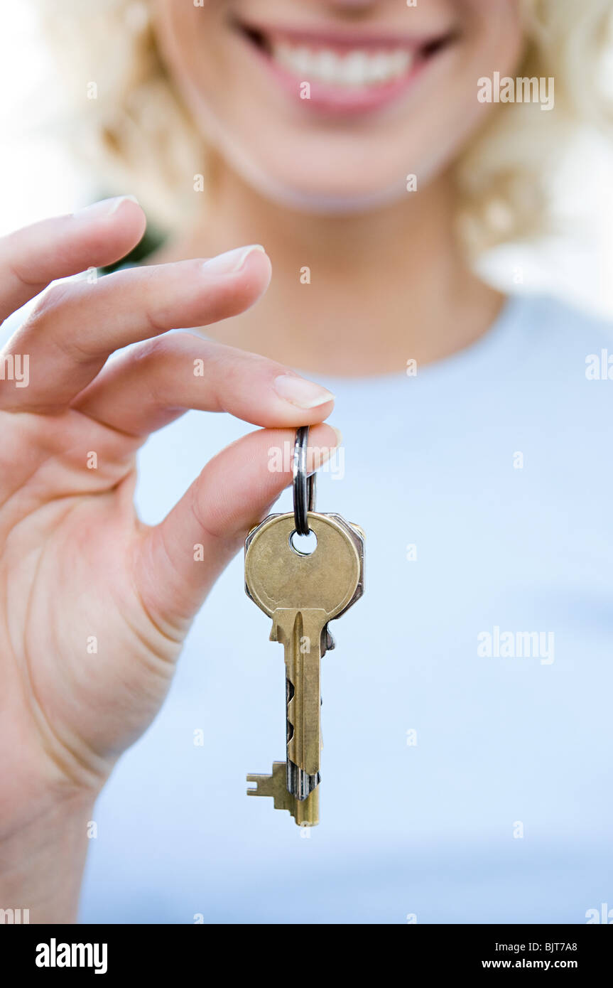 Woman with keys Stock Photo - Alamy