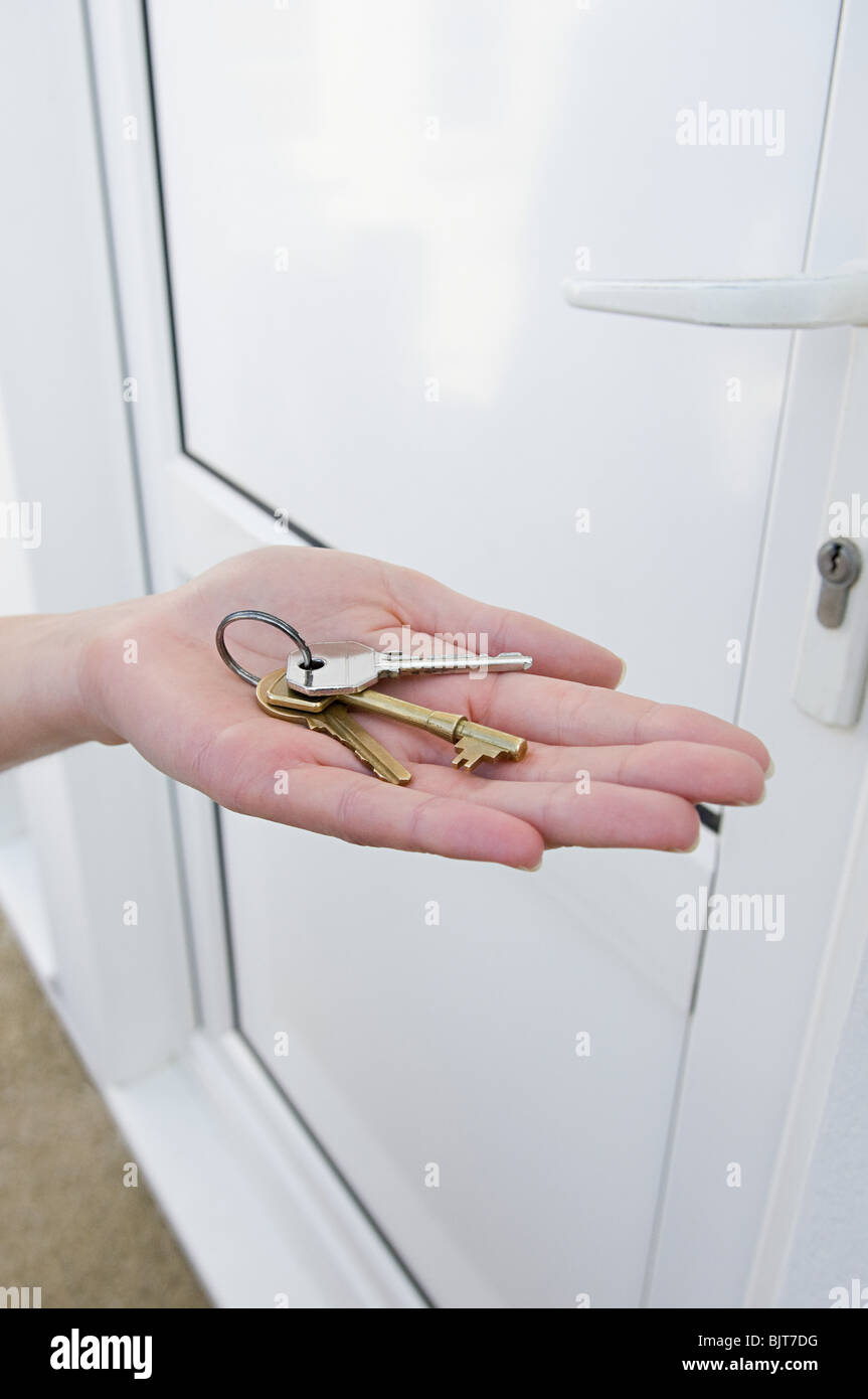 Person holding keys Stock Photo - Alamy