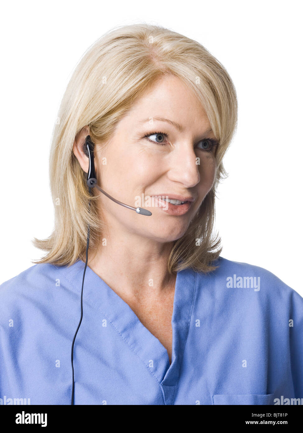 Female nurse using headset, studio shot Stock Photo - Alamy
