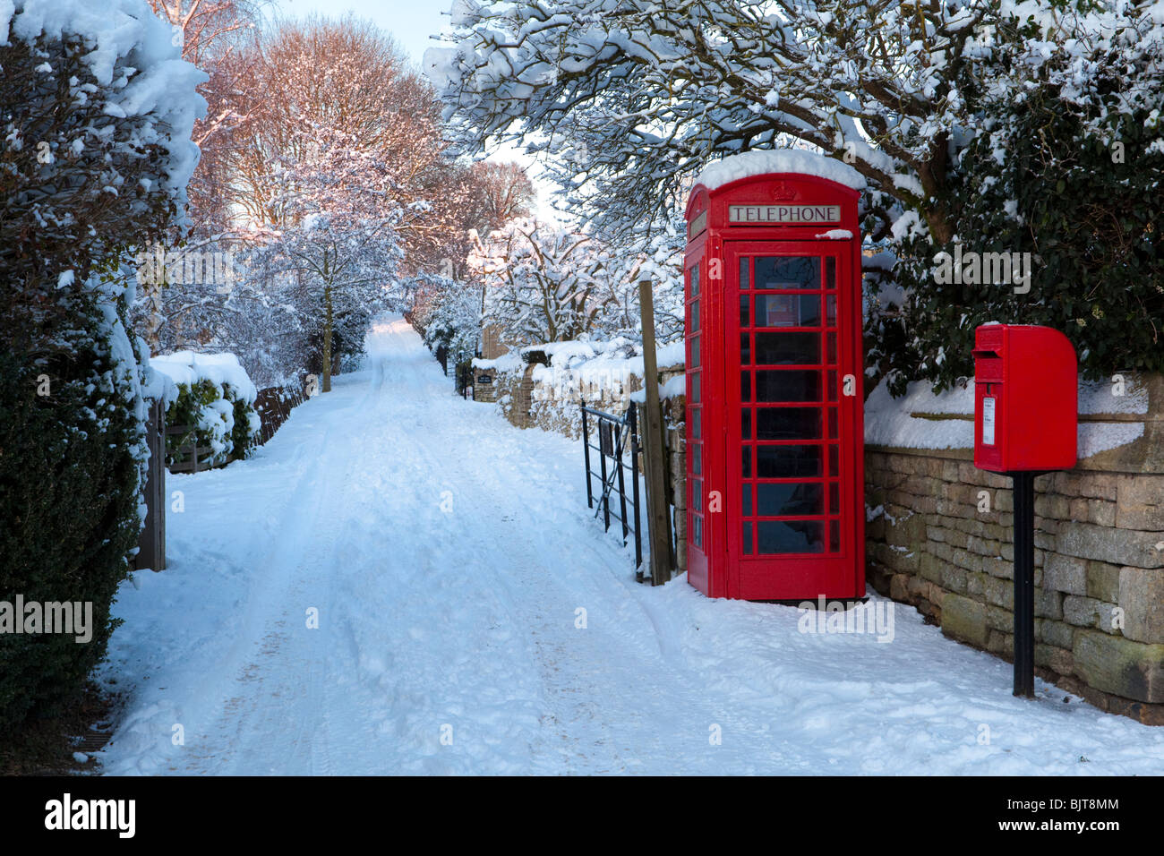 Dusk falling on winter snow and the Cotswold Way in the Cotswold ...