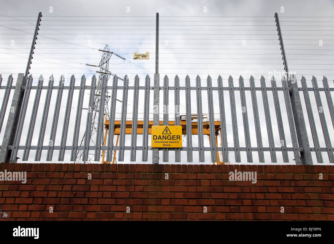 Electric fence and danger sign in East London UK Stock Photo - Alamy
