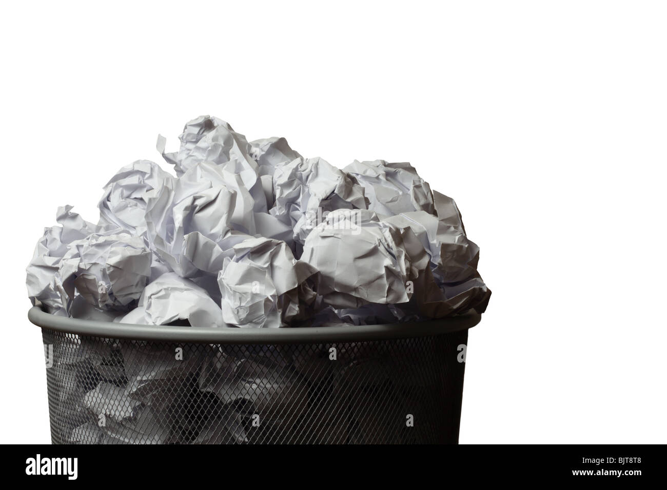 Waste bin full of screwed up pieces of paper. Cutout on a white ...