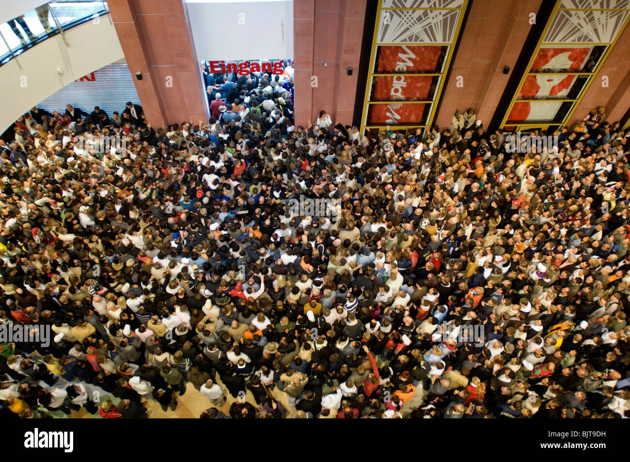 Crowd waiting for the opening of a new shopping centre Stock Photo - Alamy