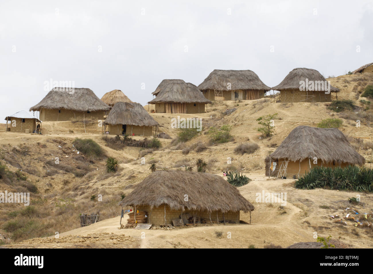 Mud and thatch housing on the outskirts of Port Amboim. Kwanza Sul ...