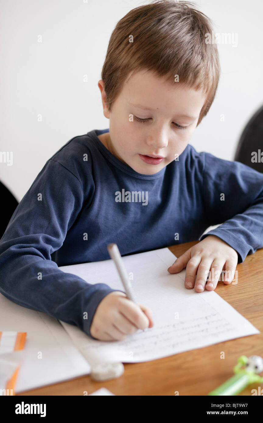 Young boy is practicing his writing skills, Berlin, Germany Stock Photo ...