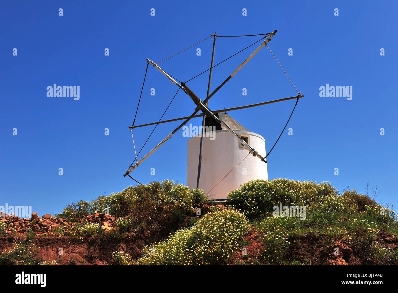 Old style windmill in , Algarve, Portugal Stock Photo - Alamy