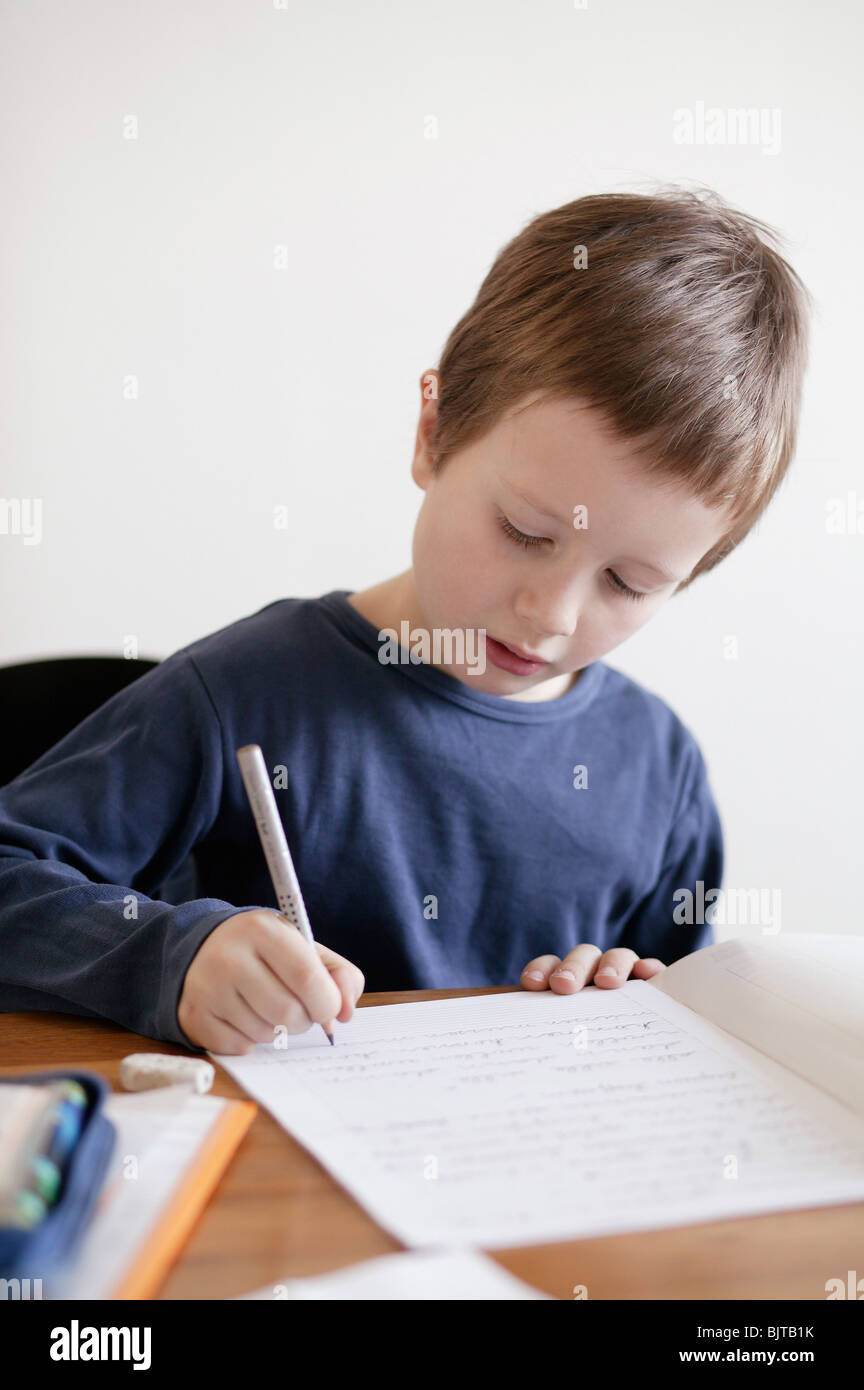 Young boy is practicing his writing skills, Berlin, Germany Stock Photo ...
