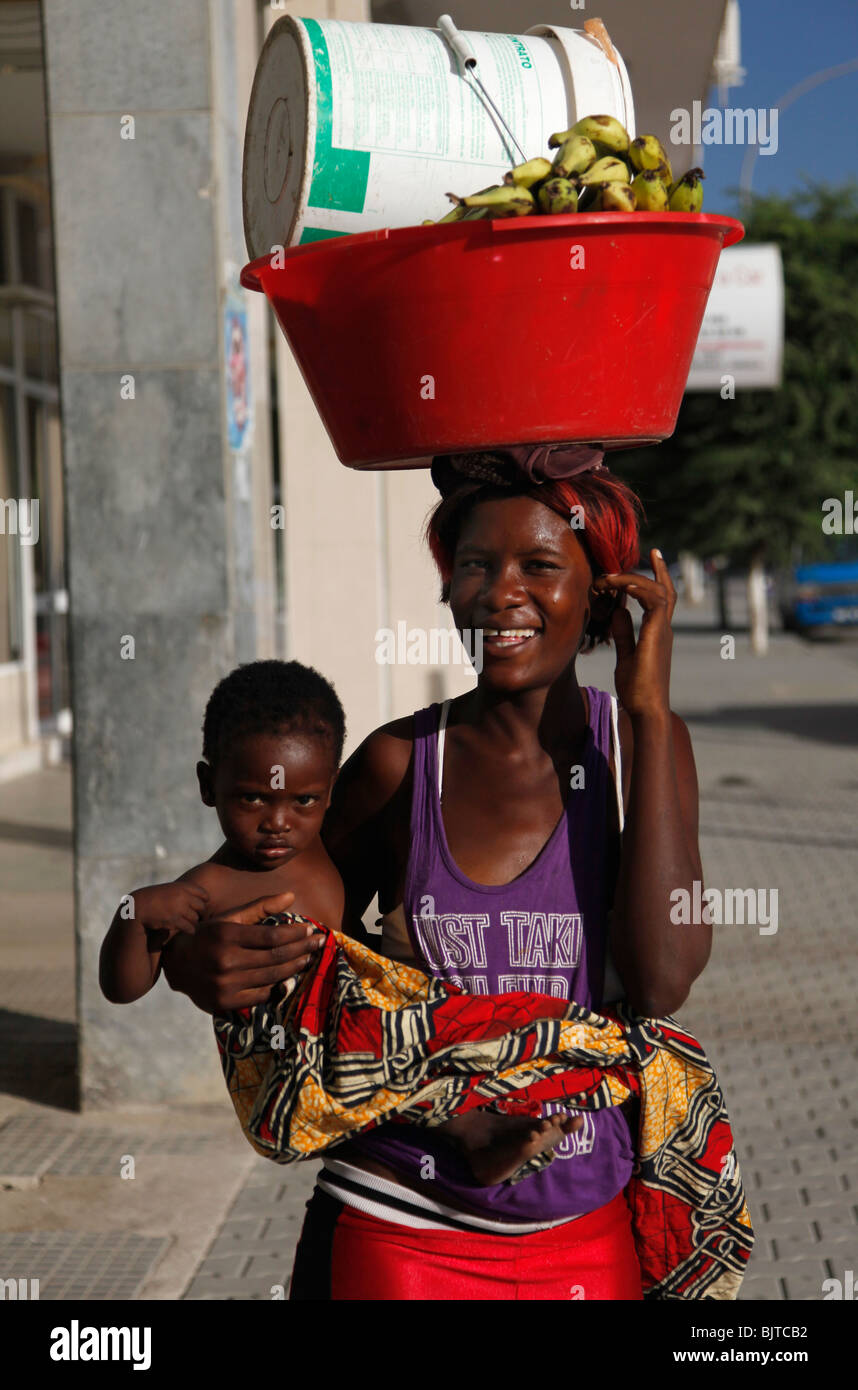 African woman carrying bucket on head High Resolution Stock Photography ...