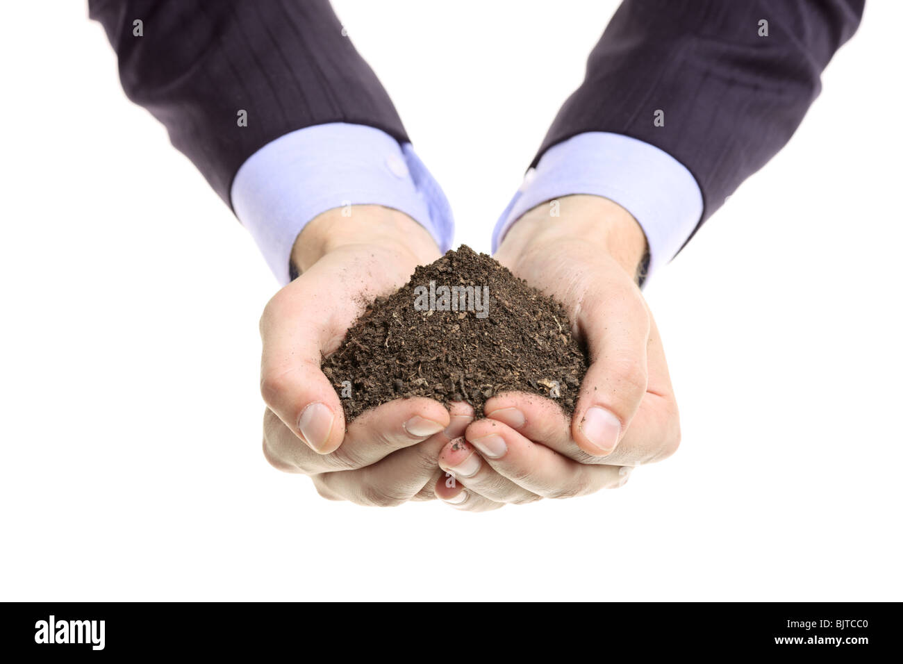 Hands holding a pile of soil Stock Photo - Alamy