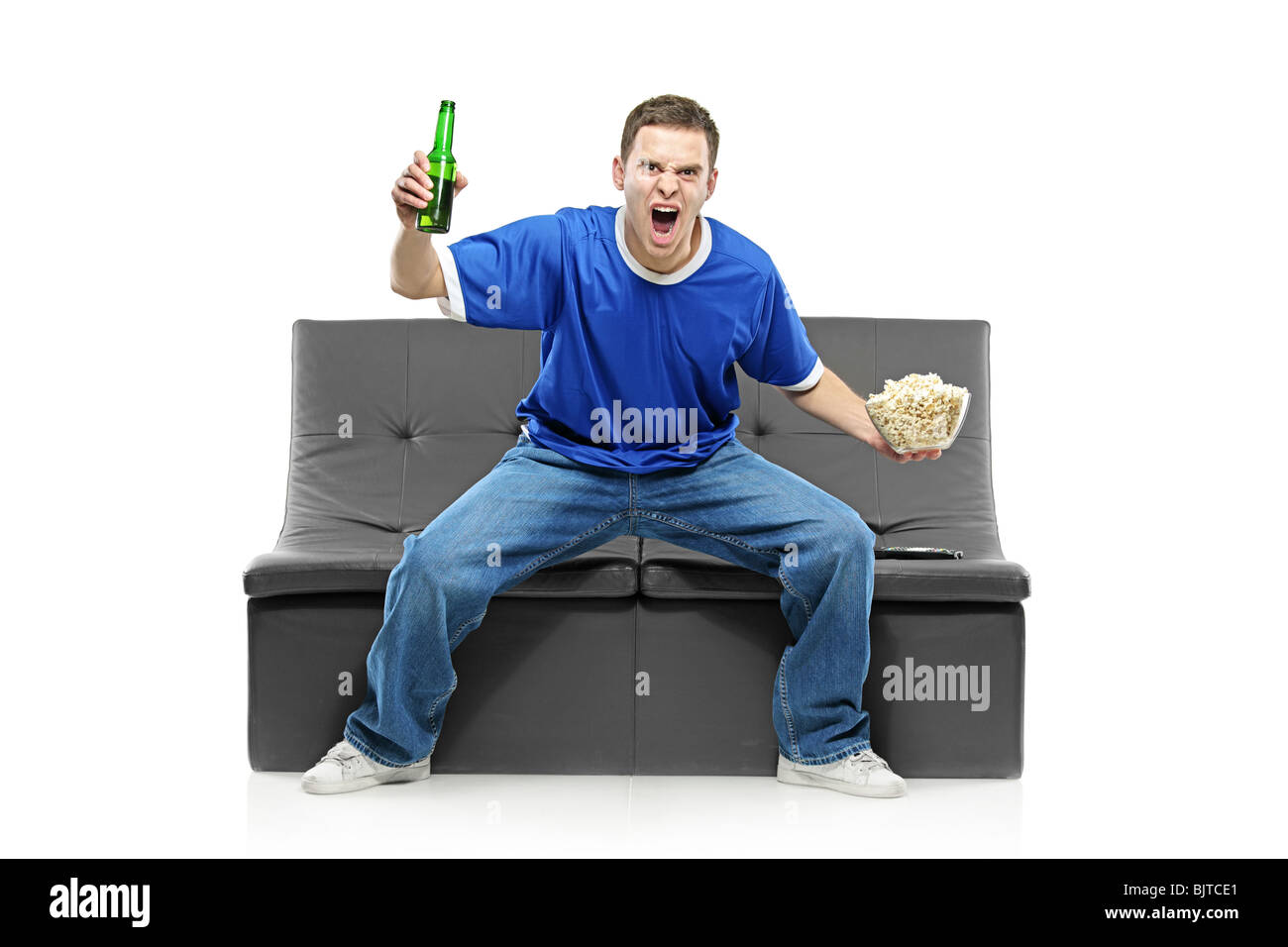 Excited man watching sport Stock Photo - Alamy